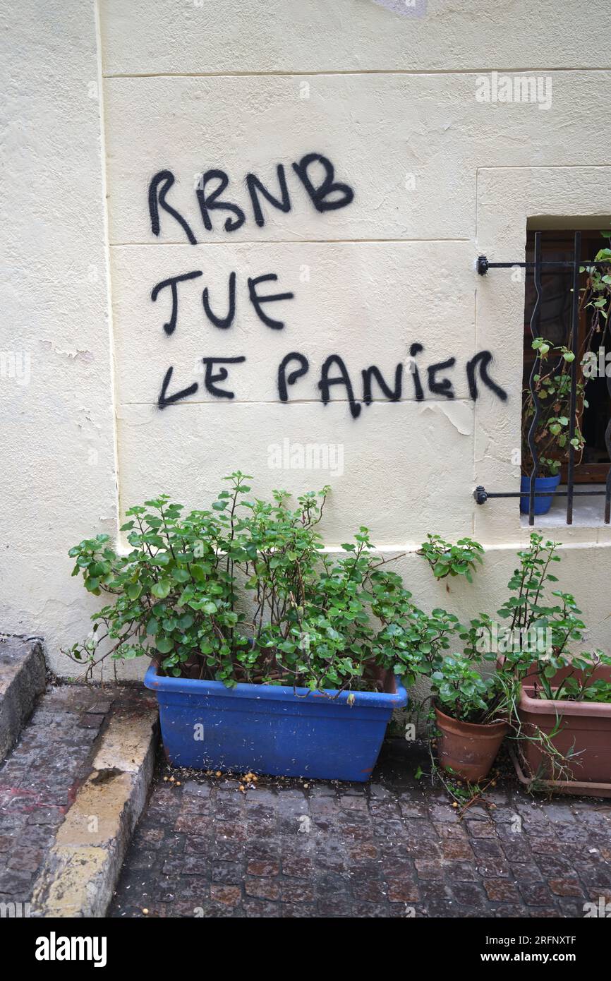 Anti Airbnb protest graffiti in Le Panier District Marseille France ...
