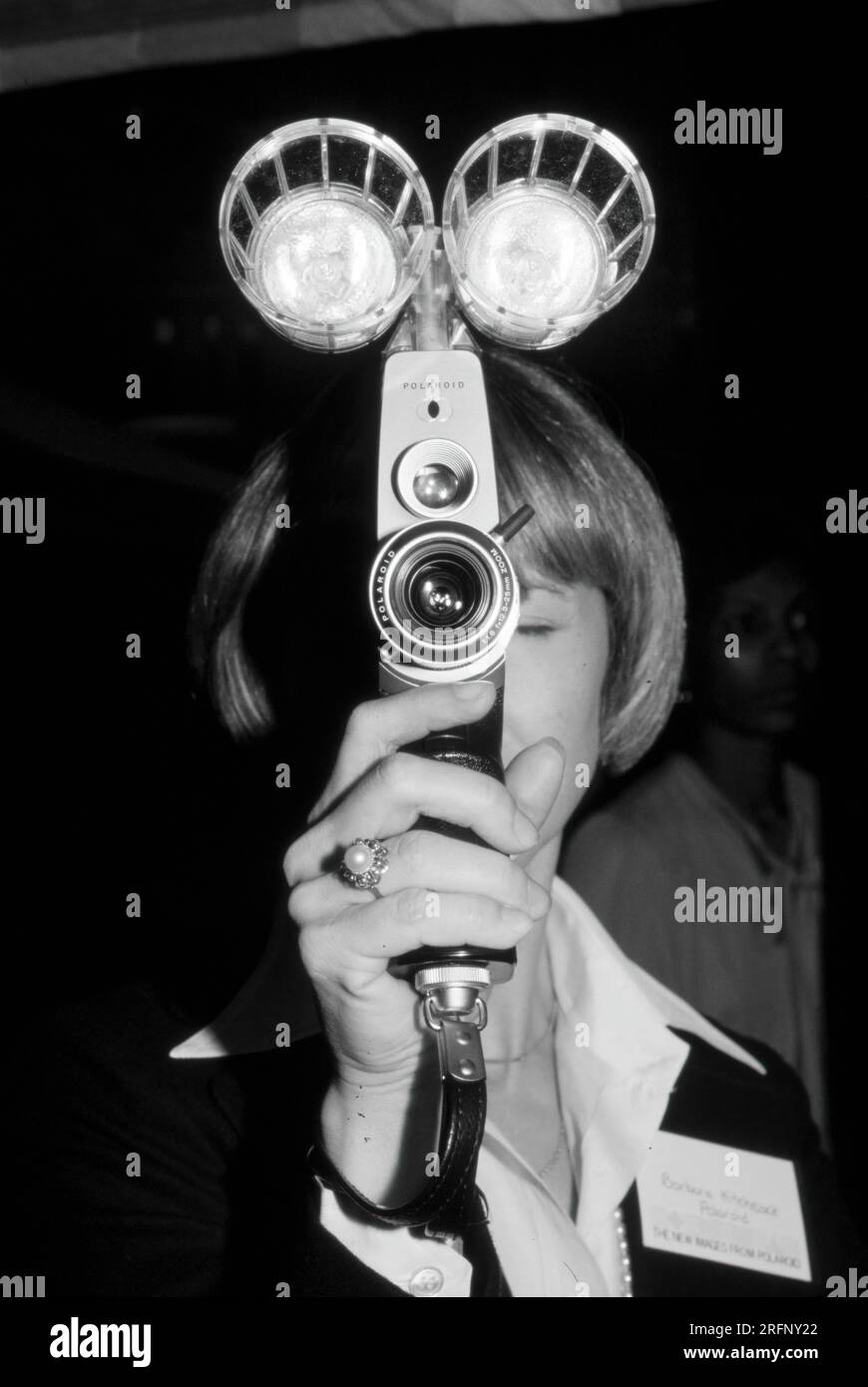 Andy Warhol with new Polaroid Polavision movie camera at an art opening ...