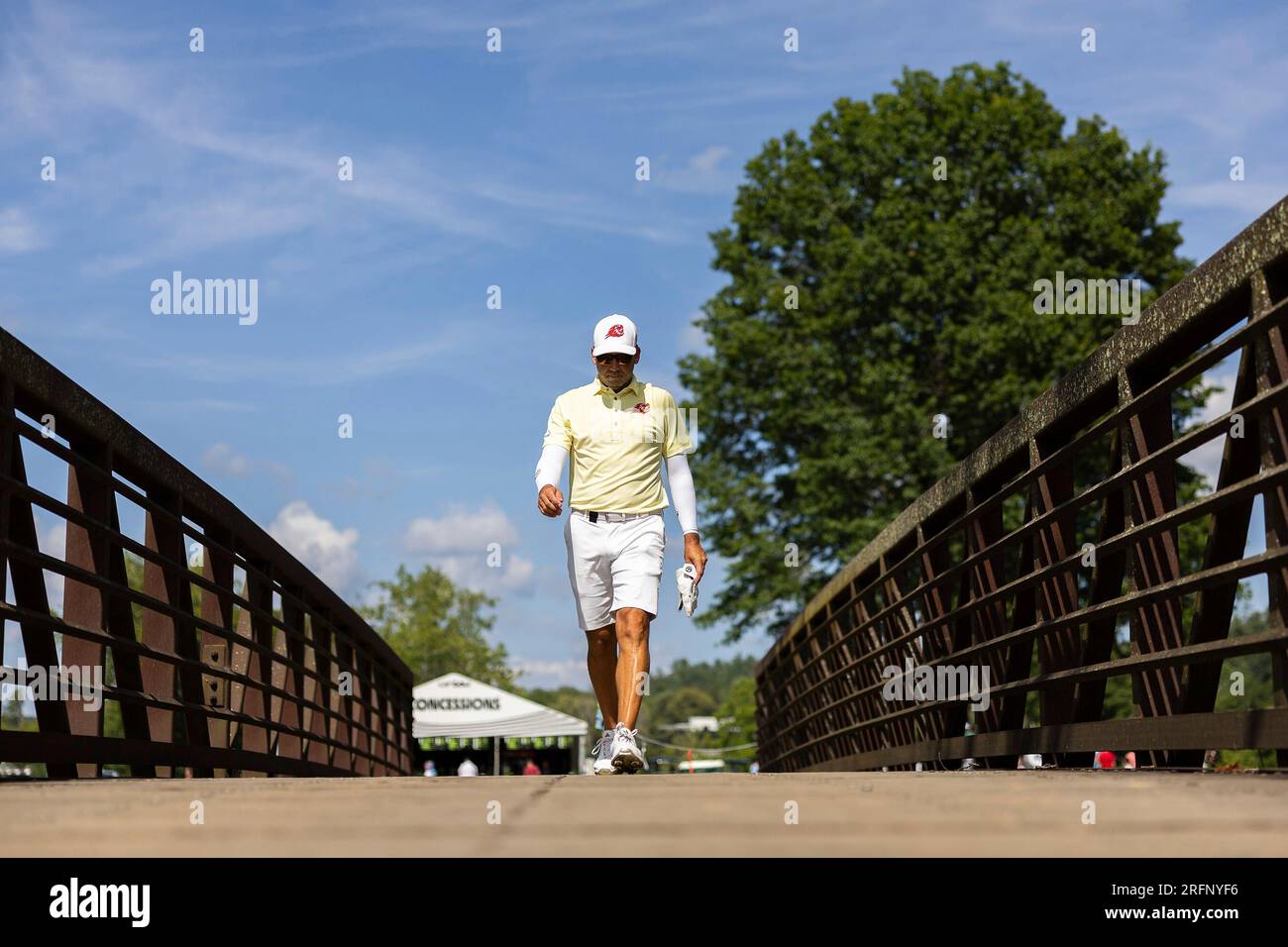 Captain Sergio Garcia of Fireballs GC walks over a bridge during the ...
