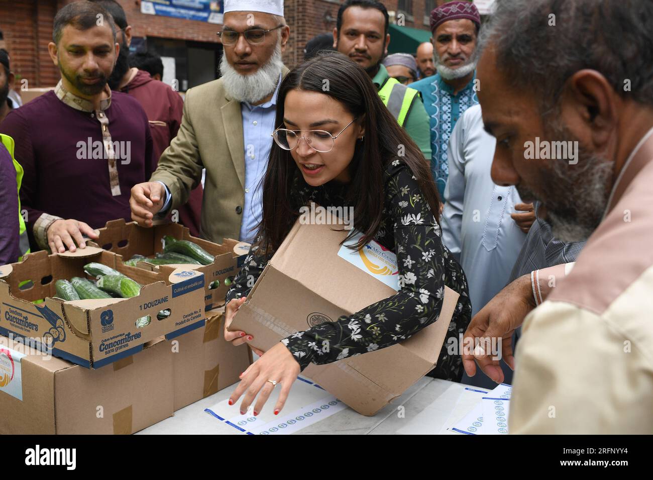 New York, USA. 04th Aug, 2023. Rep. Alexandria Ocasio-Cortez helps ...