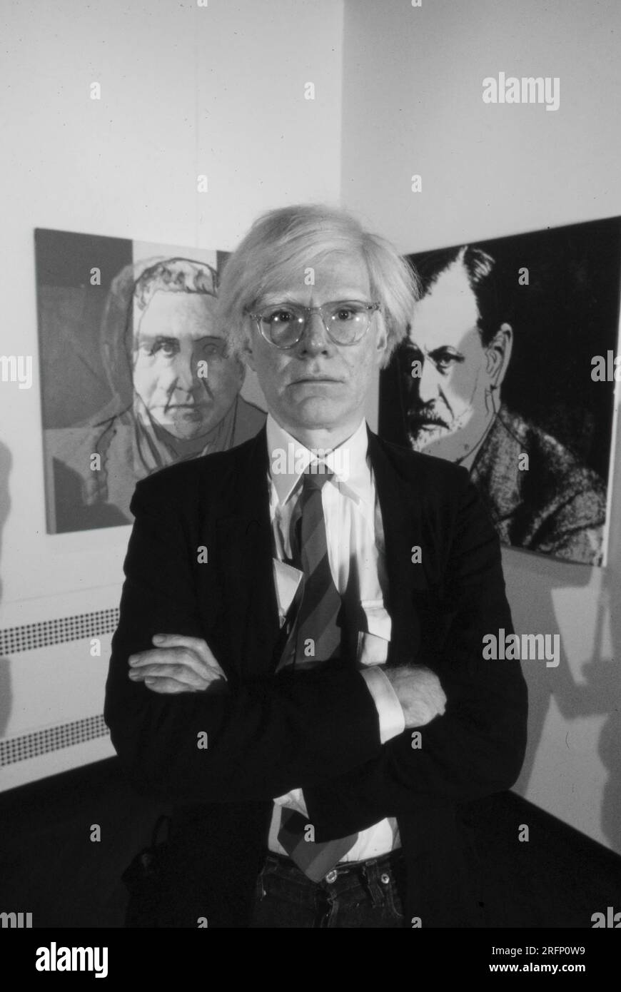 Andy Warhol in a NY gallery with his art portraits in 1975. Warhol was ...