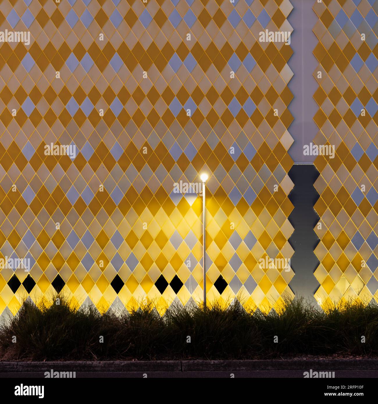 Modern building facade in yellow, orange, silver and grey diamond ...