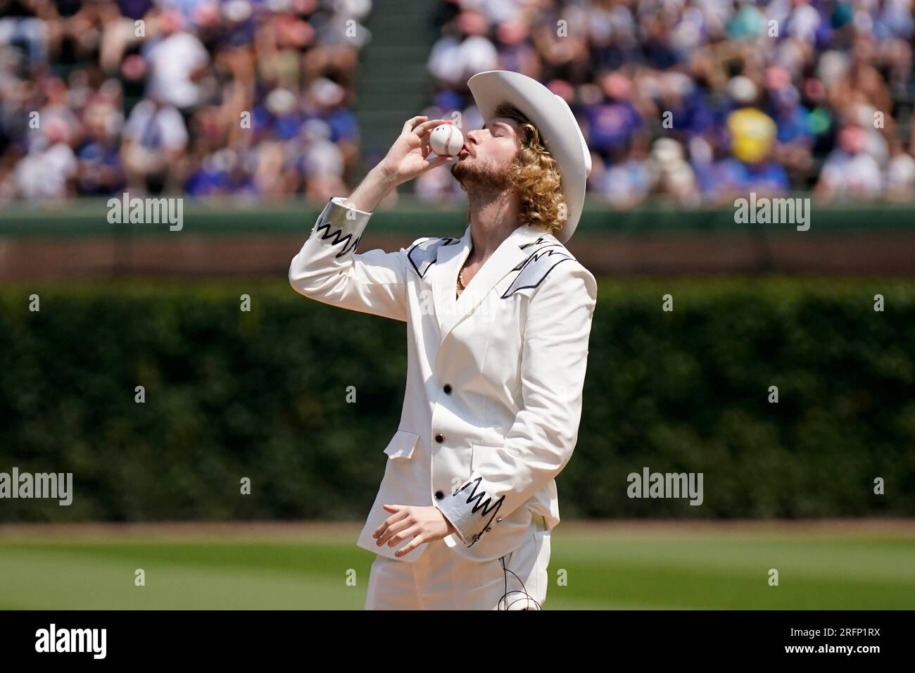Rapper Yung Gravy kisses the baseball before throwing out a ceremonial ...