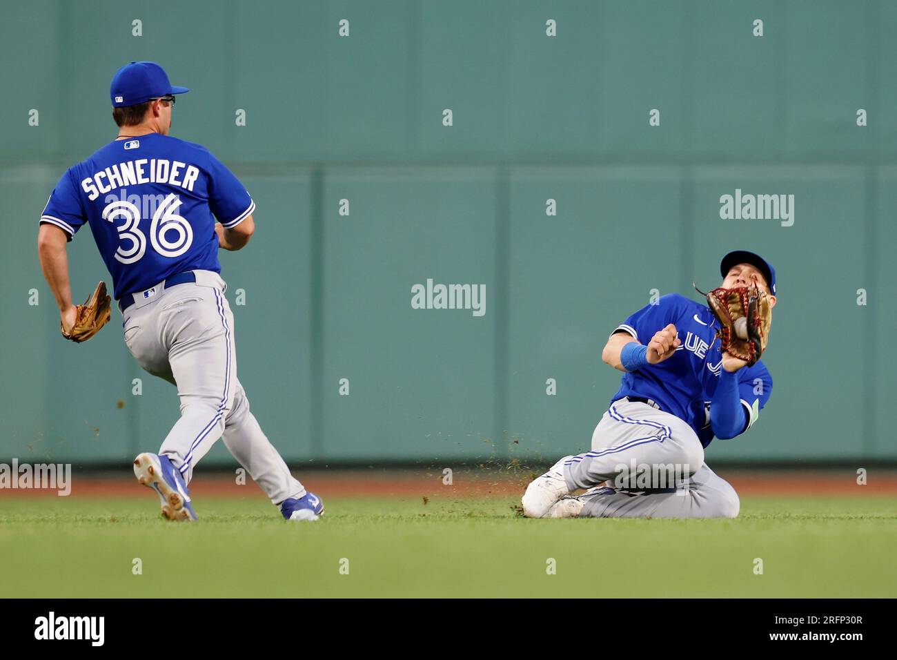 Toronto Blue Jays' Davis Schneider (36) watches as Daulton Varsho makes ...