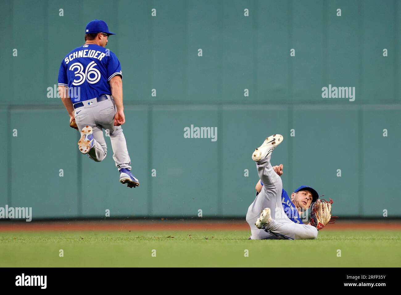 Toronto Blue Jays' Davis Schneider (36) leaps after Daulton Varsho made ...