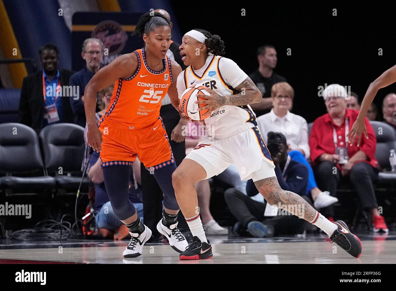 Indiana Fever's Emma Cannon is defended by Connecticut Sun's Alyssa ...