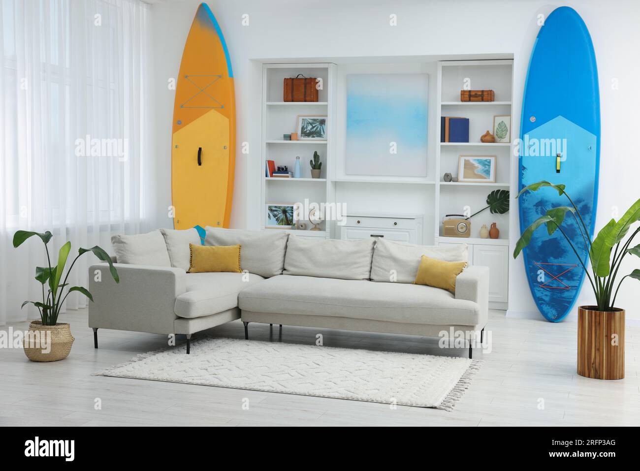 SUP boards, shelving unit with different decor elements and stylish ...