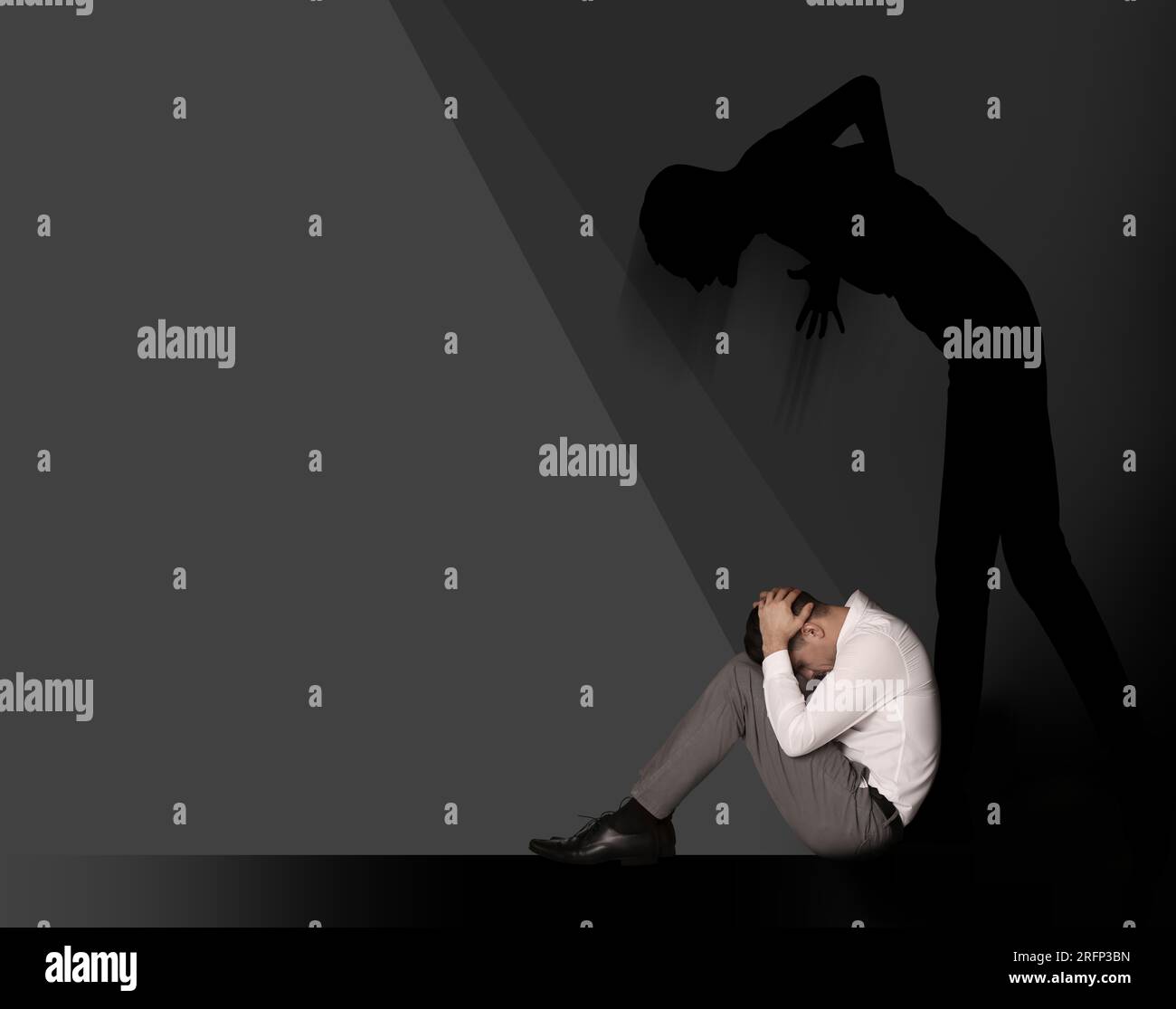 Suffering from hallucinations. Scared man hiding head because of scary ...