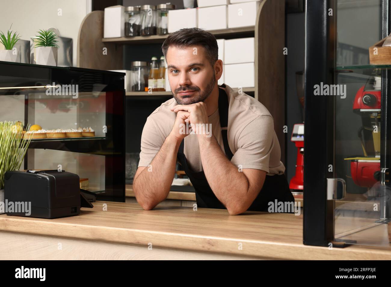 Business owner near showcase hi-res stock photography and images - Alamy