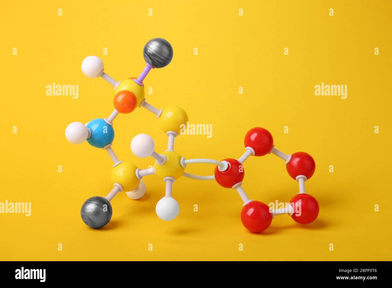 Structure of molecule on yellow background. Chemical model Stock Photo ...