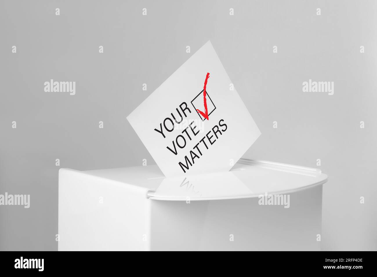 Paper with text Your Vote Matters and tick sticking out of ballot box ...