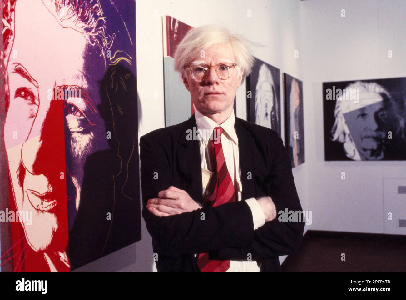 Andy Warhol in a NY gallery with his art portraits in 1975. Warhol was ...