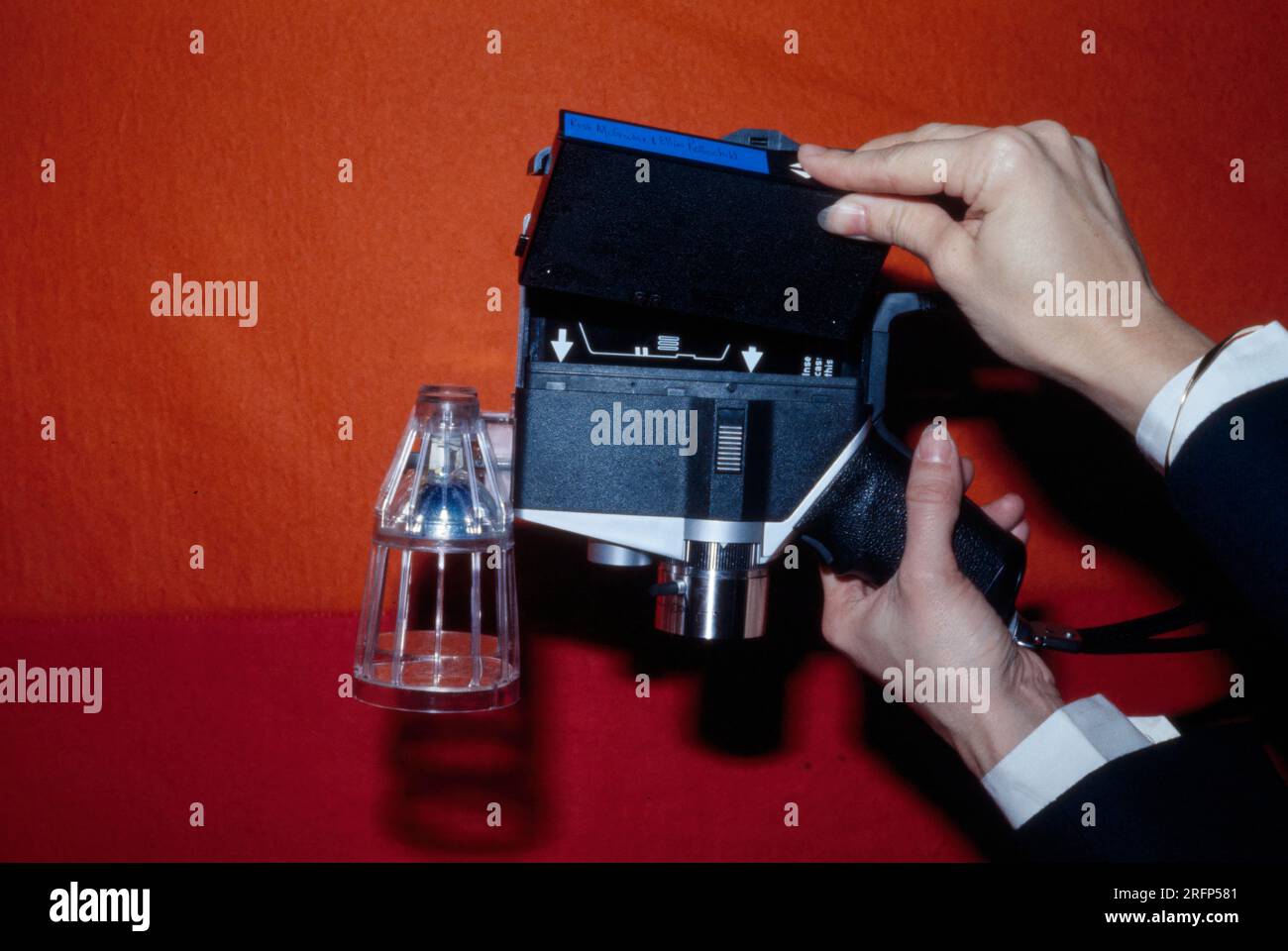 Andy Warhol with new Polaroid Polavision movie camera at an art opening ...