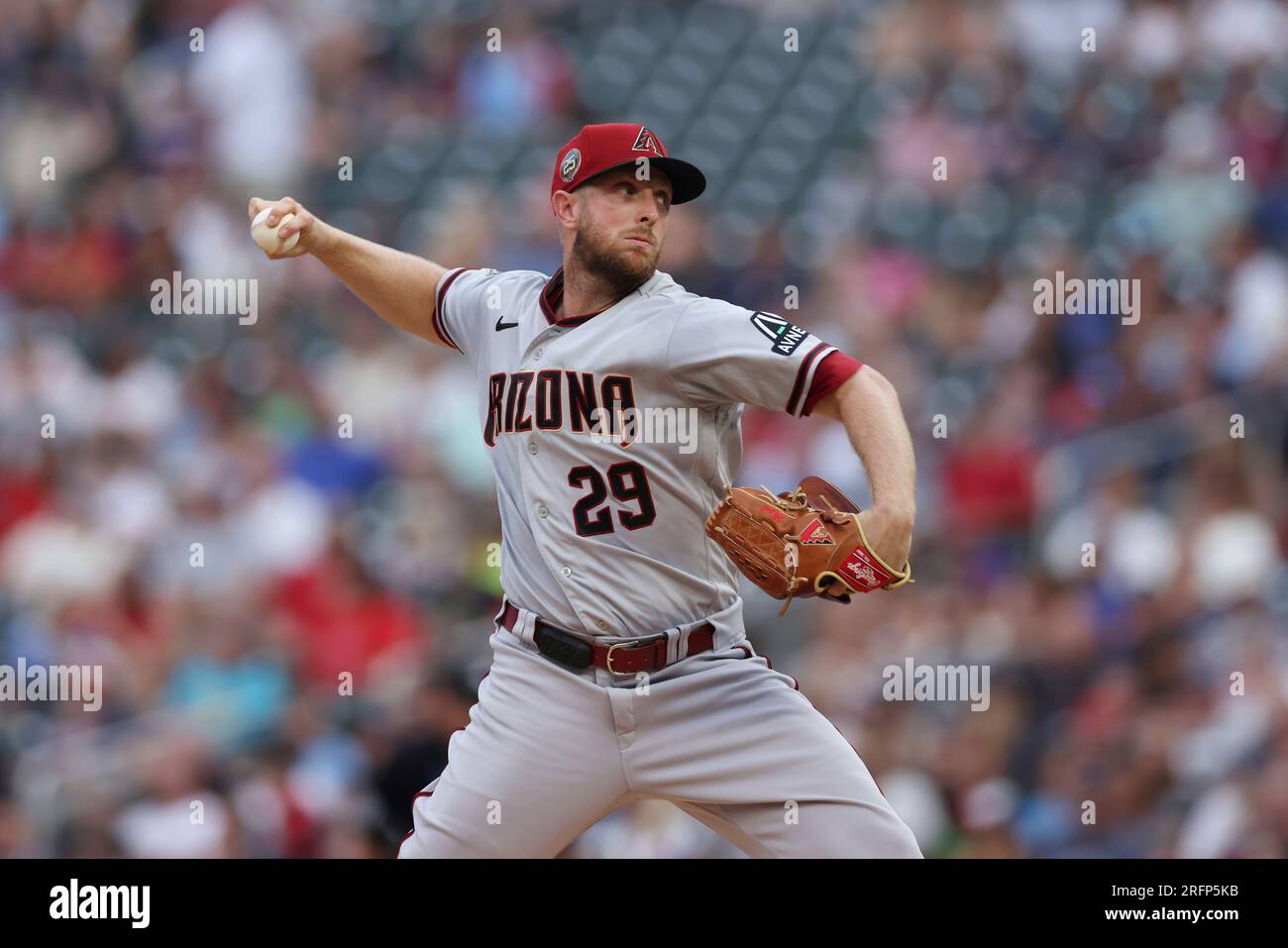 Arizona Diamondbacks pitcher Merrill Kelly throws to a Minnesota Twins ...