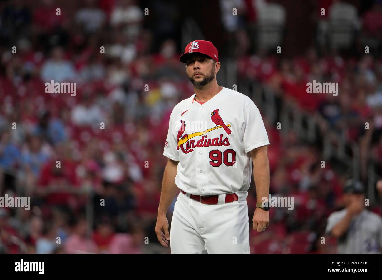 St. Louis Cardinals pitching coach Dusty Blake heads back to the dugout ...
