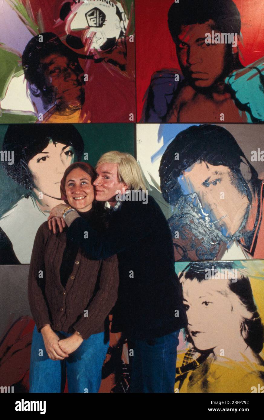 Andy Warhol in a NY gallery with his art portraits in 1975. Warhol was ...