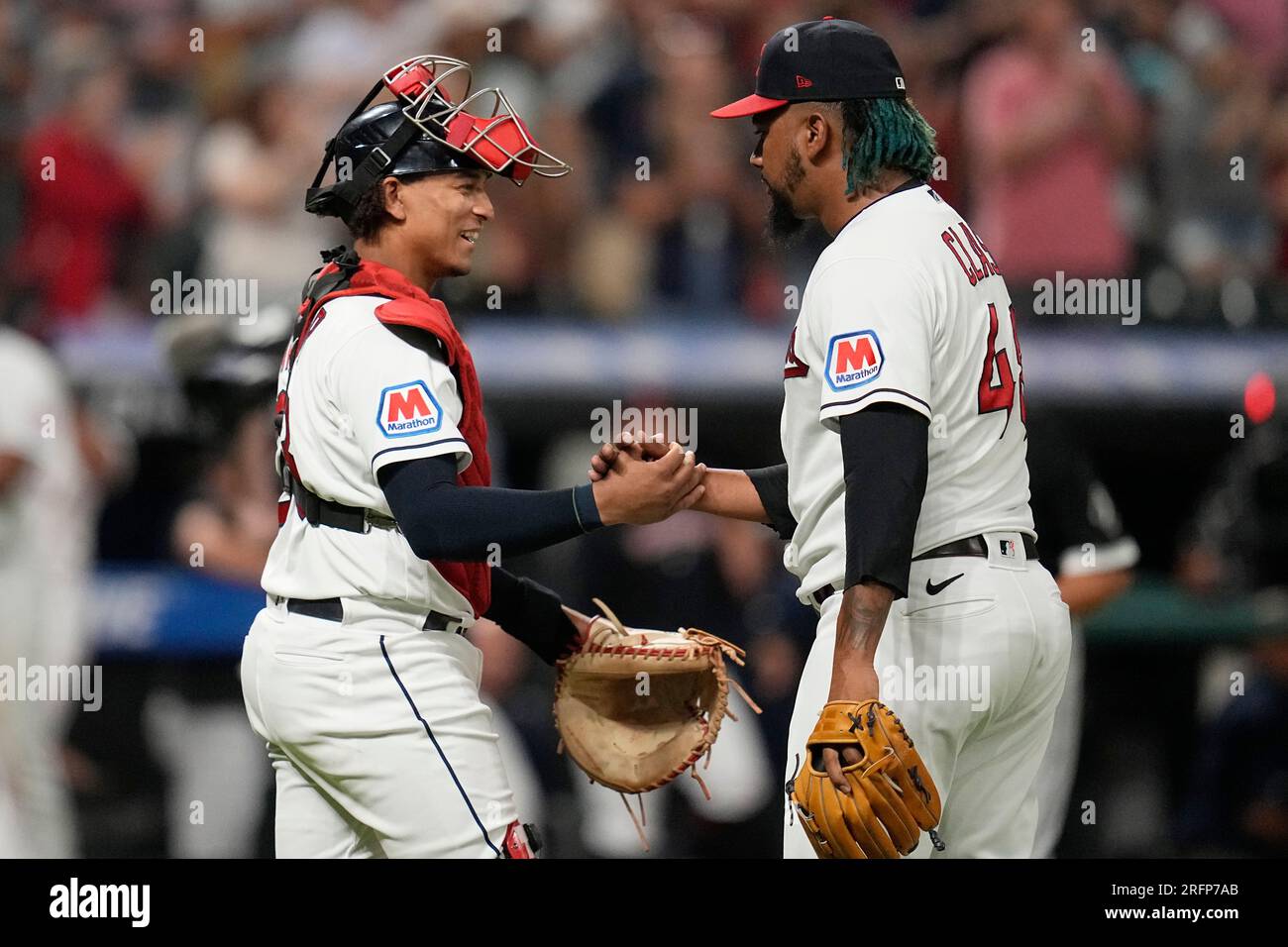 Cleveland Guardians catcher Bo Naylor, left, and relief pitcher ...