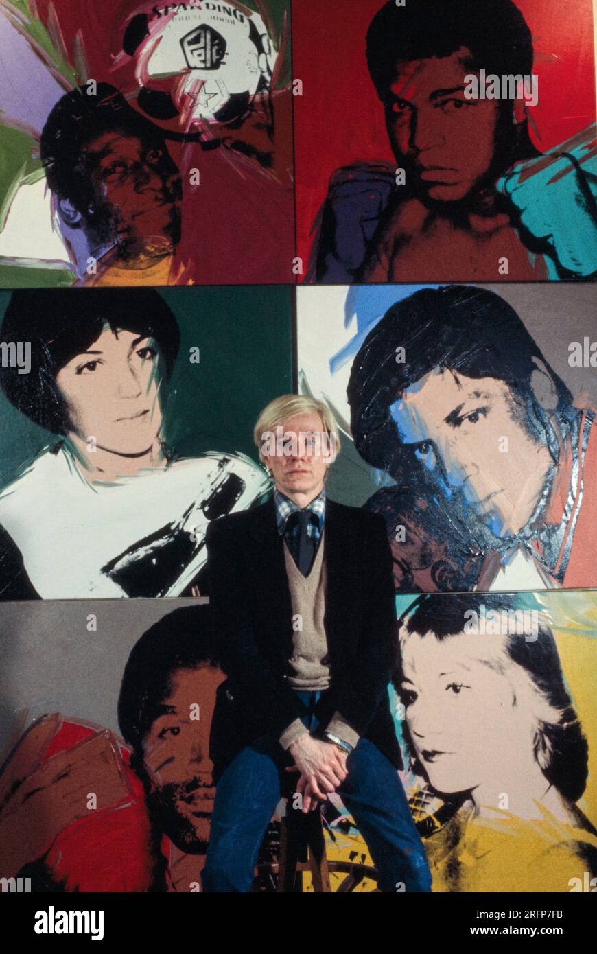 Andy Warhol in a NY gallery with his art portraits in 1975. Warhol was ...