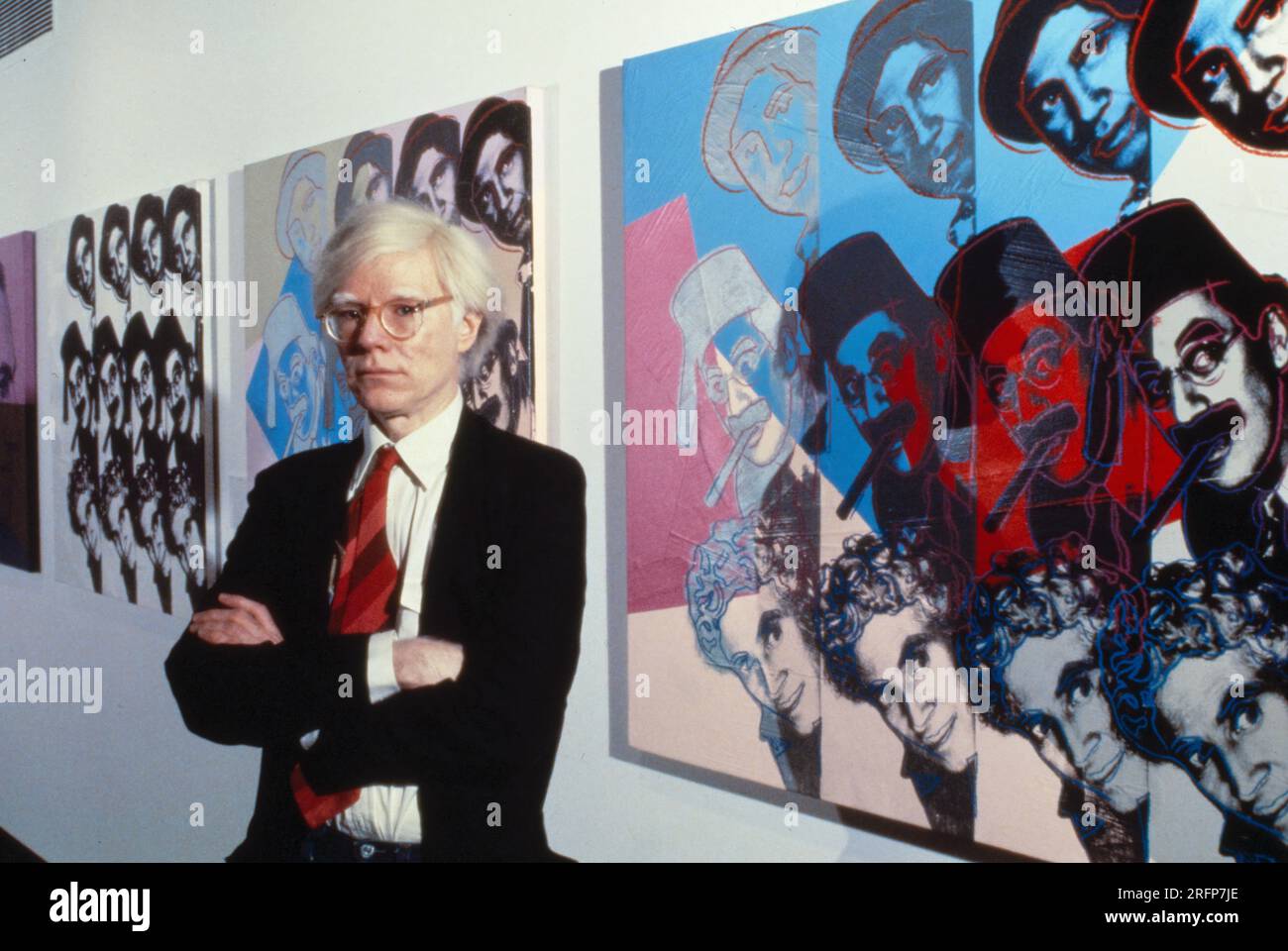Andy Warhol in a NY gallery with his art portraits in 1975. Warhol was ...