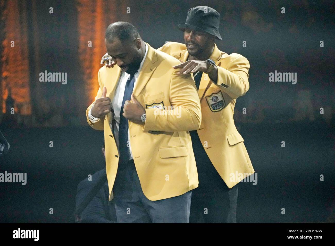 Darrelle Revis, left, a member of the Pro Football Hall of Fame Class ...