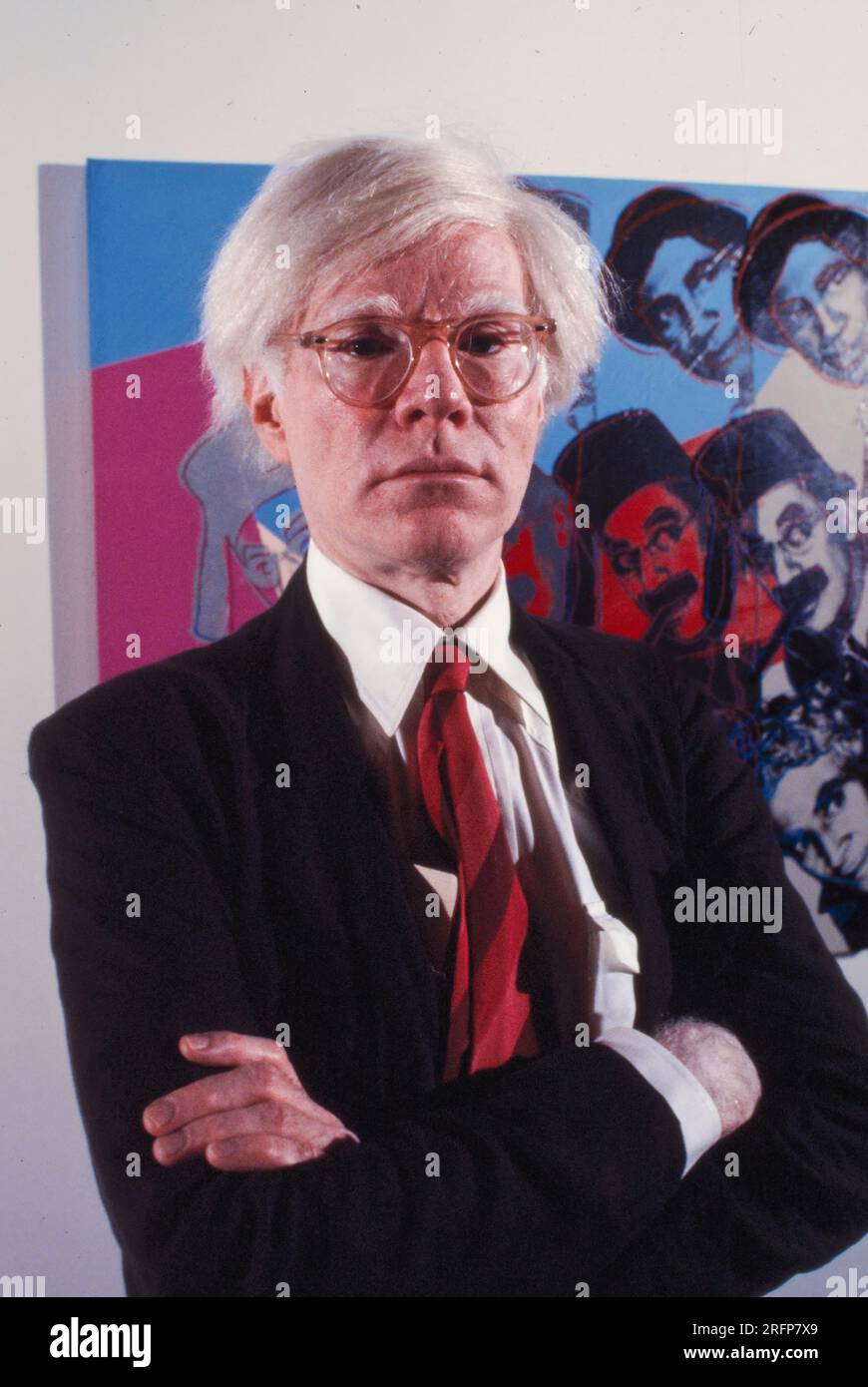 Andy Warhol in a NY gallery with his art portraits in 1975. Warhol was an American visual artist ...