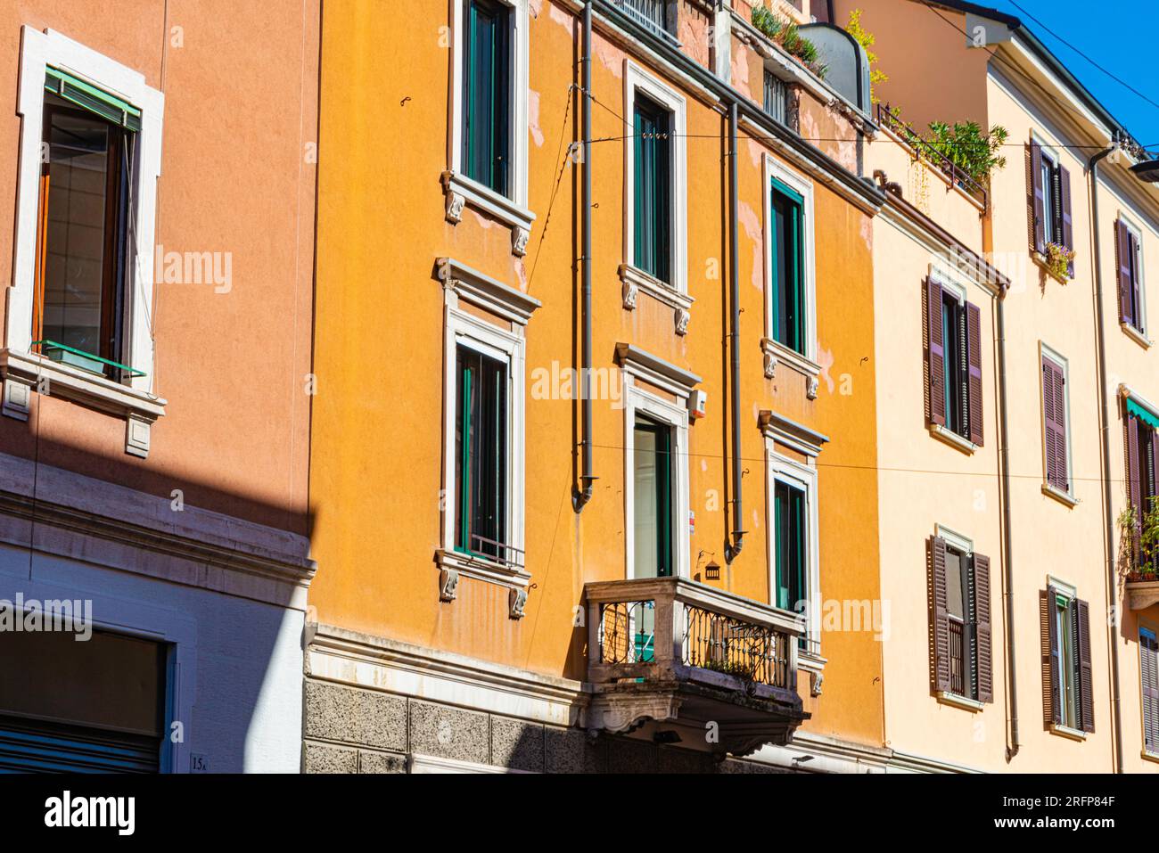 Colorful Milan apartment building side Stock Photo - Alamy