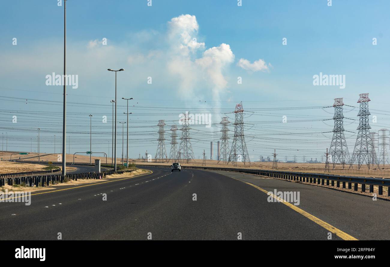 A picture of a highway in Kuwait, with multiple powerlines crossing ...