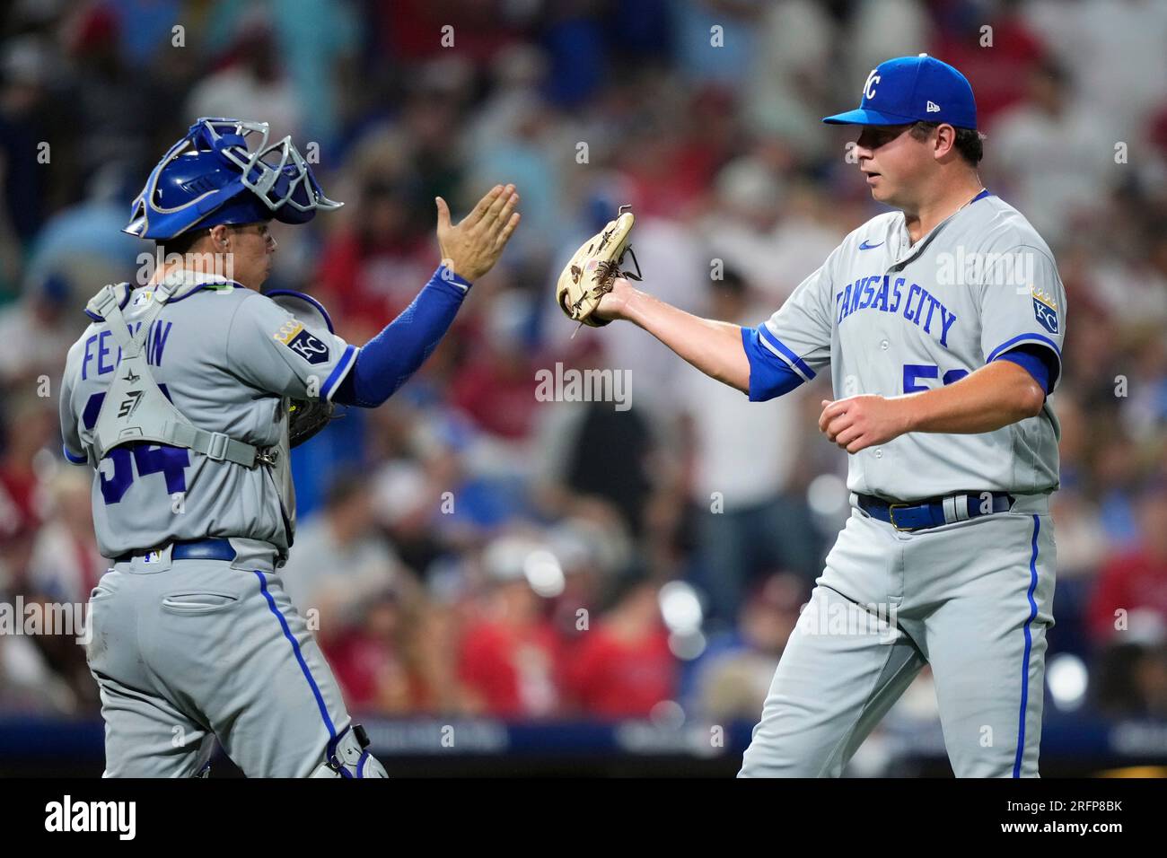 Kansas City Royals' Austin Cox, right, and Freddy Fermin celebrate ...