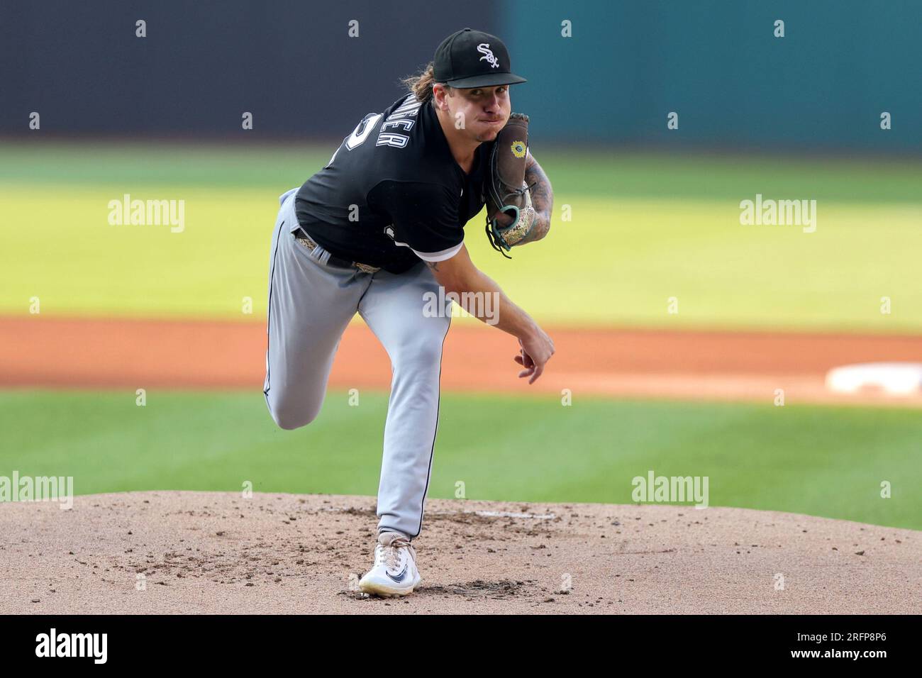 CLEVELAND, OH - AUGUST 04: Chicago White Sox starting pitcher Mike Clevinger (52) delivers a ...
