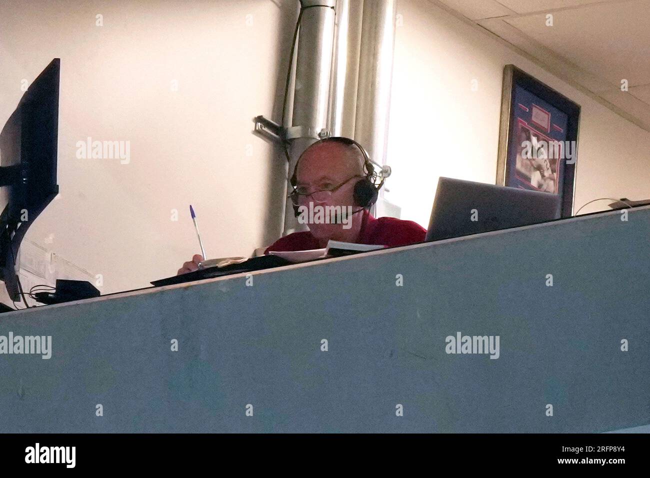 Texas Rangers broadcaster Eric Nadel watches from the press box during ...