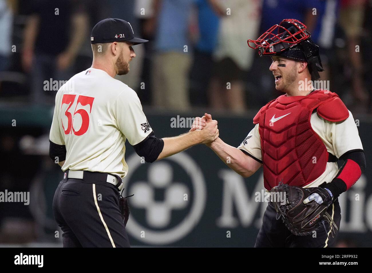 Texas Rangers relief pitcher Chris Stratton (35) is congratulated by ...
