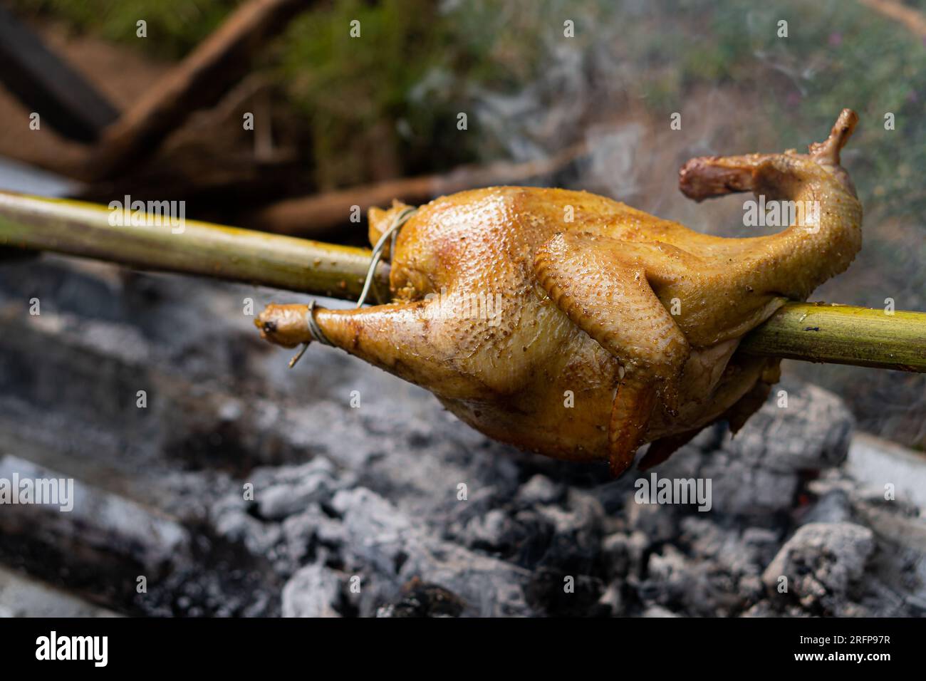 spit roasted chicken over coals Stock Photo - Alamy
