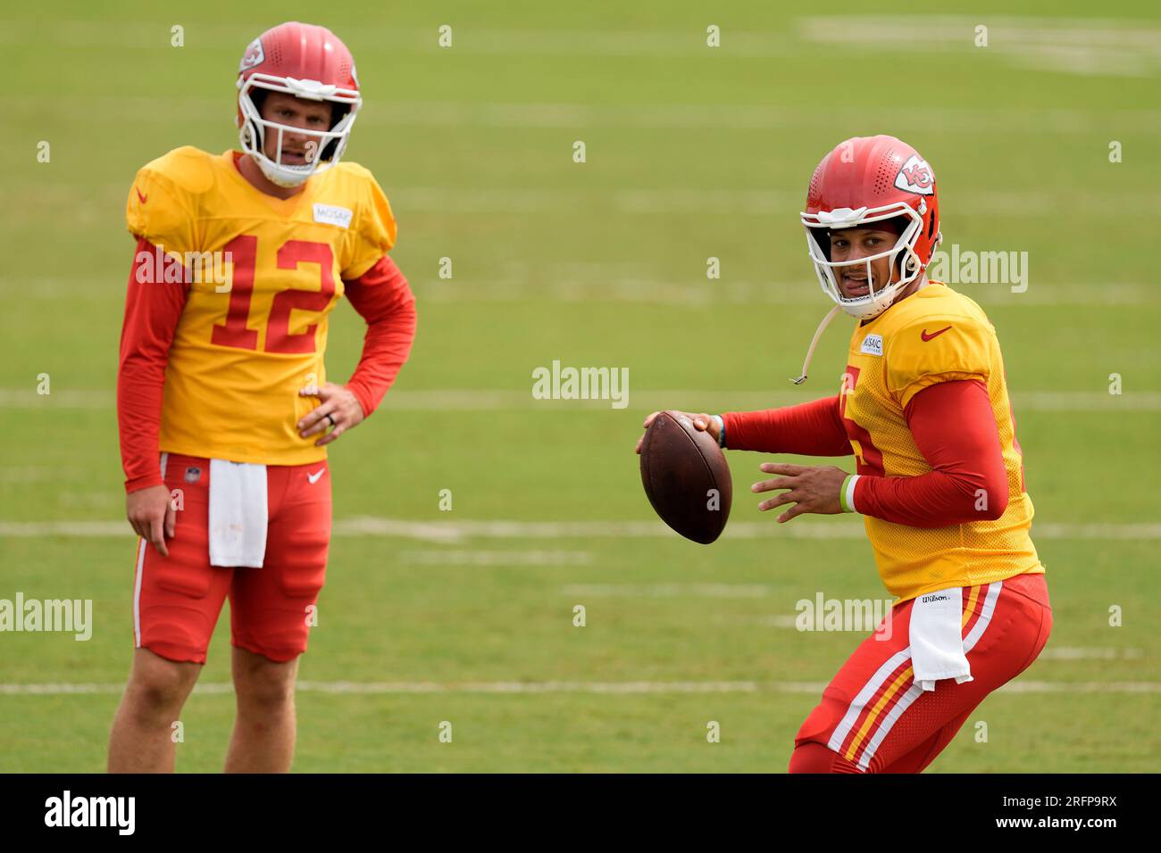 Kansas City Chiefs quarterback Patrick Mahomes, right, looks to pass ...