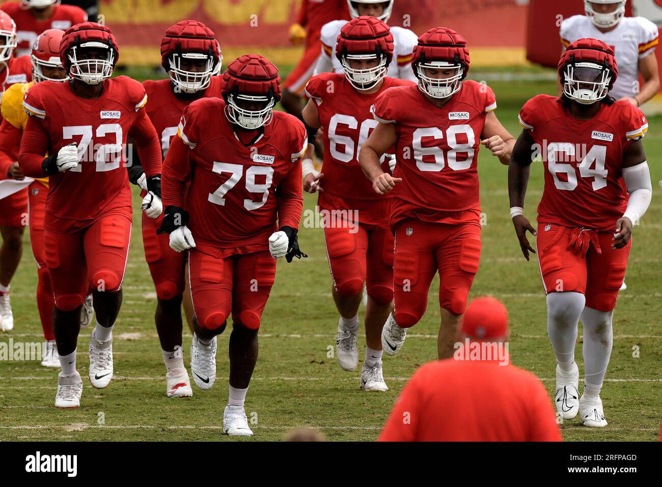 Kansas City Chiefs players run during NFL football training camp Friday ...