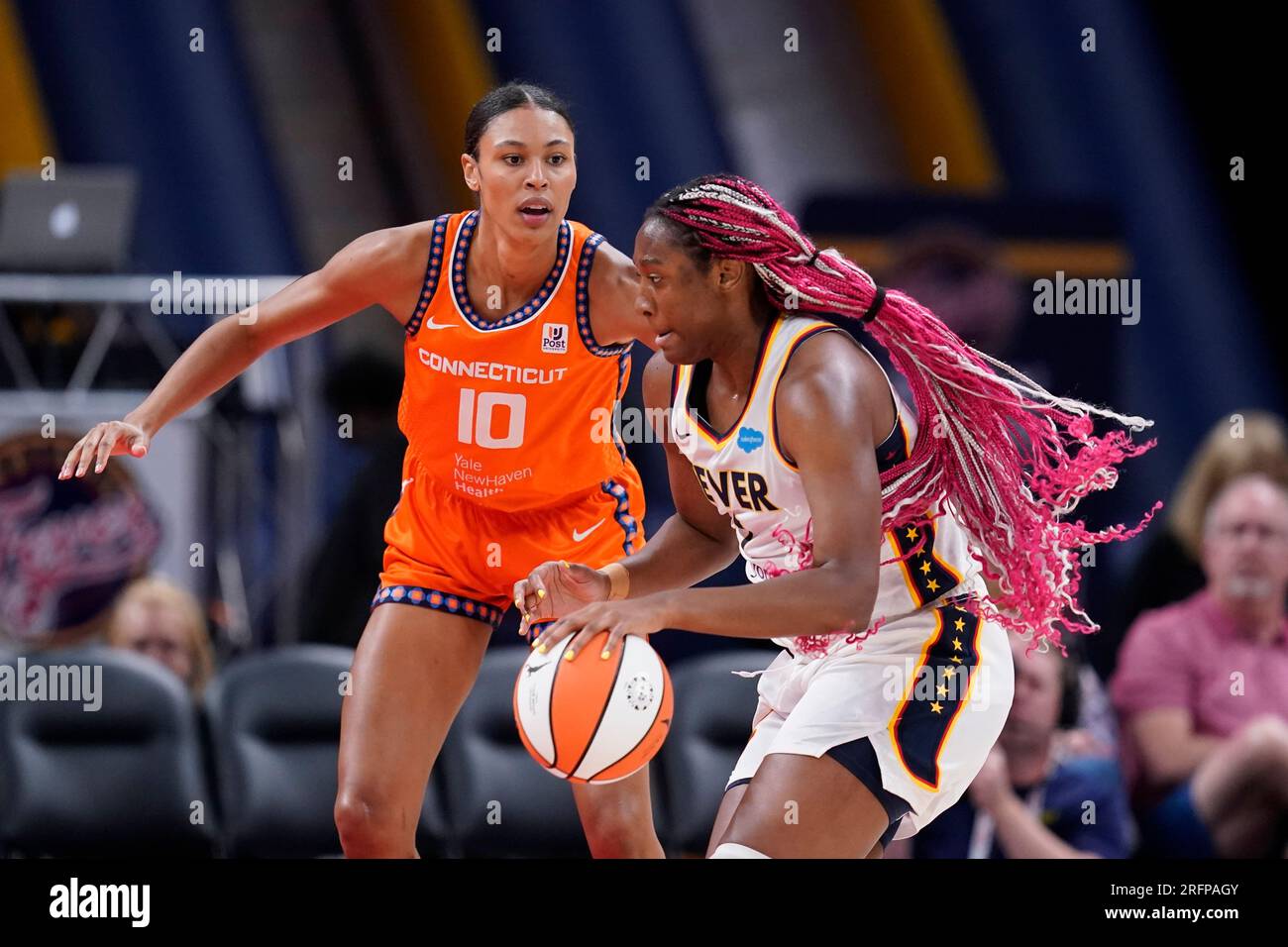 Indiana Fever's Aliyah Boston (7) is defended by Connecticut Sun's ...