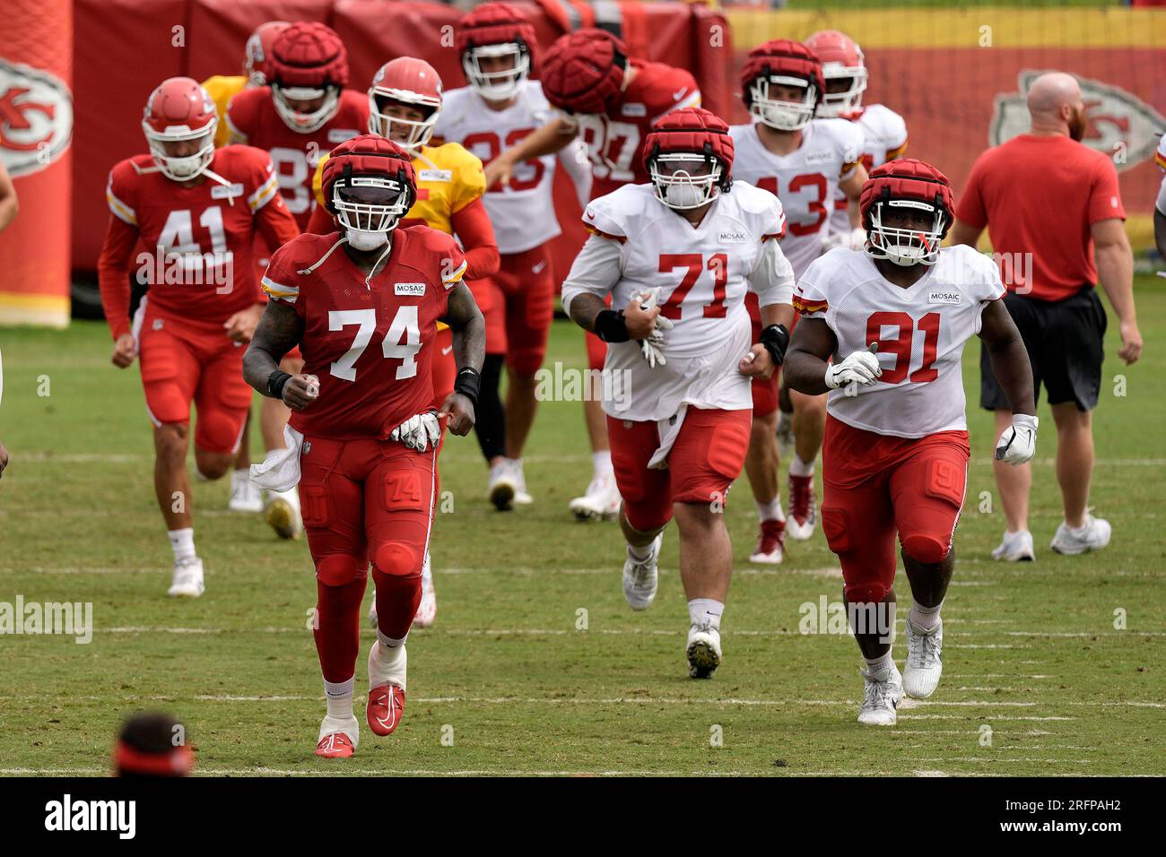 Kansas City Chiefs players run during NFL football training camp Friday ...