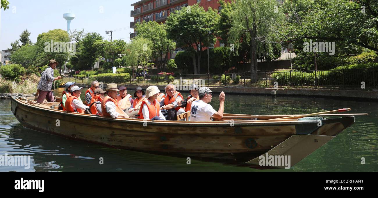 A picture shows Wasen, a traditional Japanese wooden boat propelled by ...