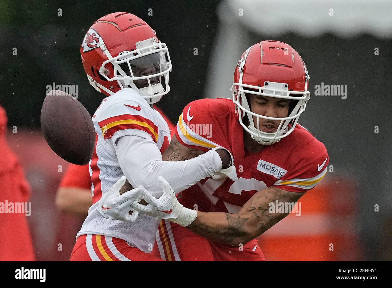 Kansas City Chiefs cornerback Ekow Boye-Doe, left, breaks up a pass ...
