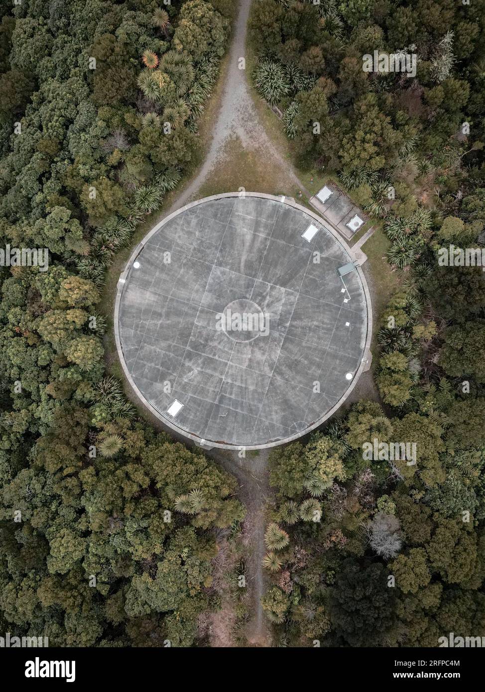 A water tower located on top of a hill. The shot was taken from a drone ...