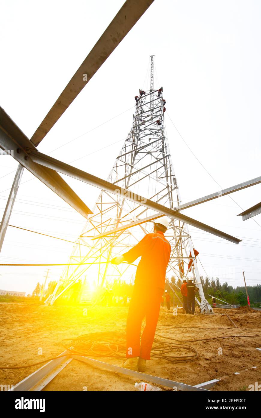 The workers of the pylon Stock Photo - Alamy
