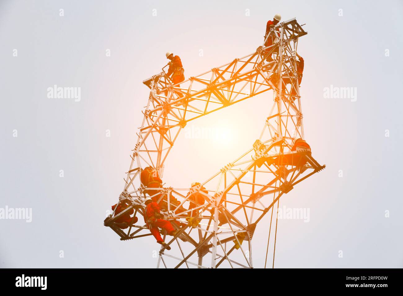 The workers of the pylon Stock Photo - Alamy