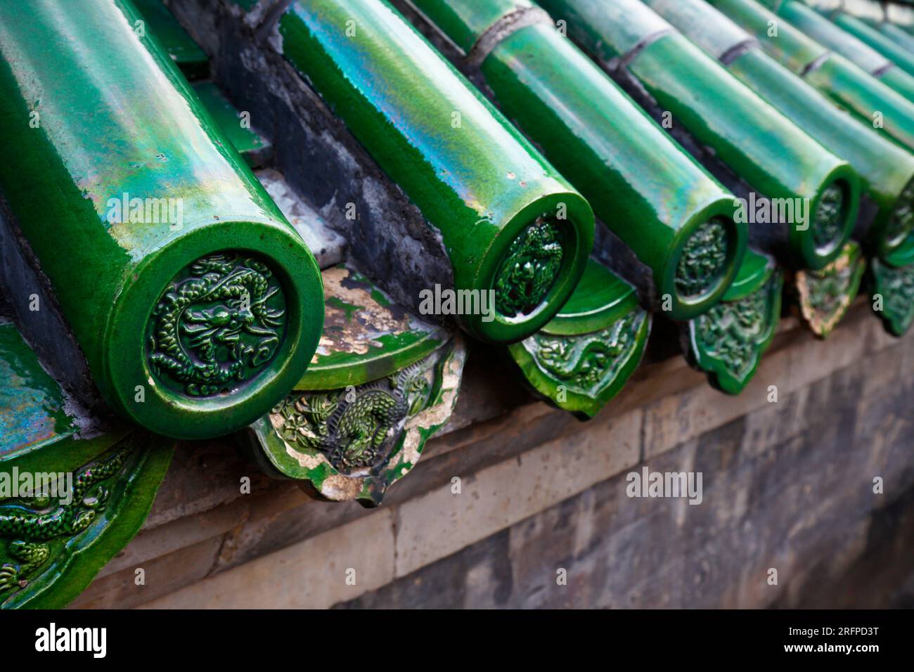 On the wall green glazed tiles as the background, the traditional ...