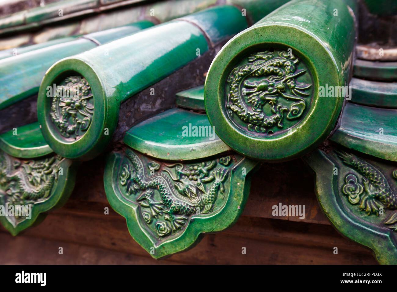 On the wall green glazed tiles as the background, the traditional ...