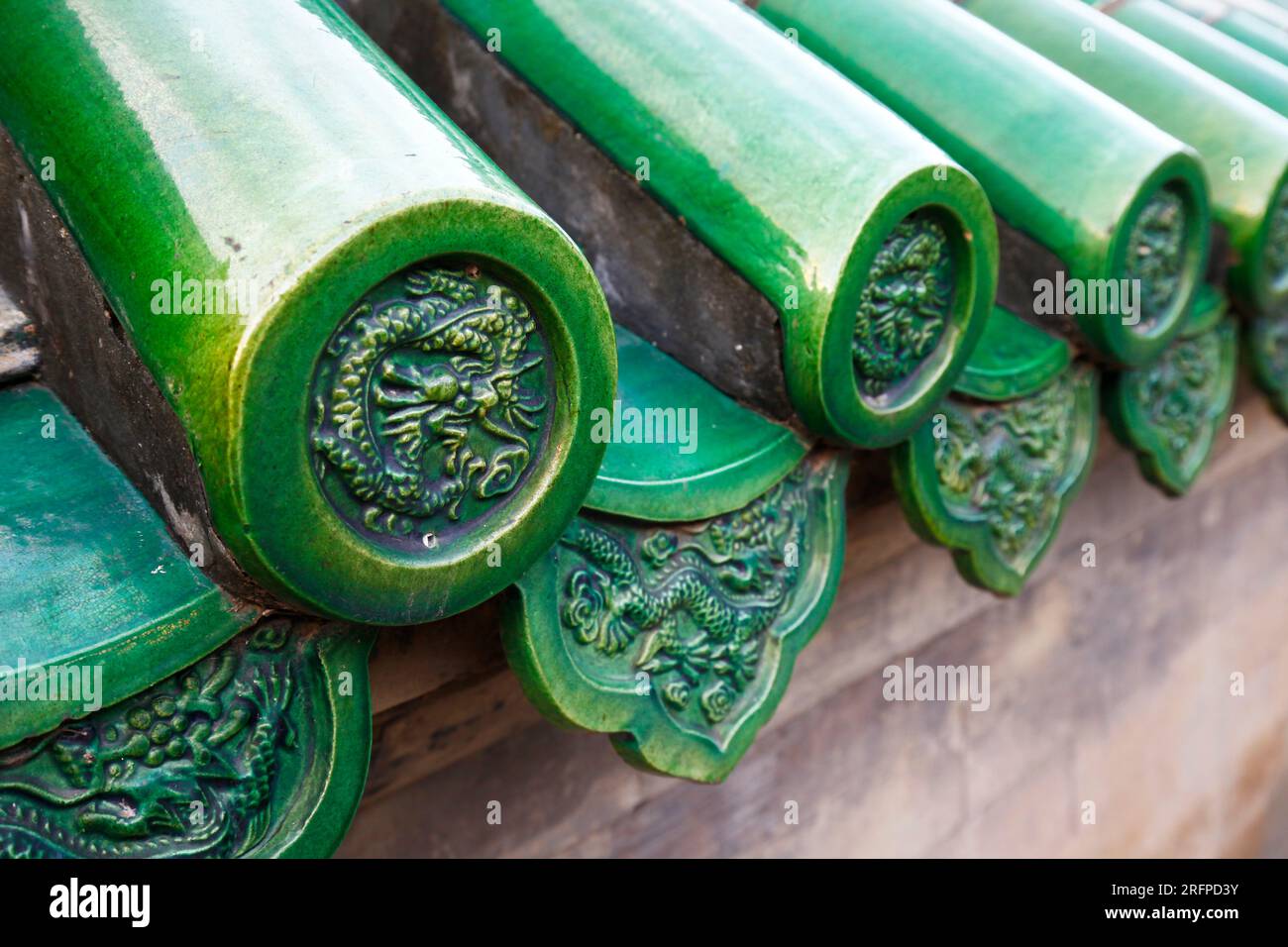 On the wall green glazed tiles as the background, the traditional ...