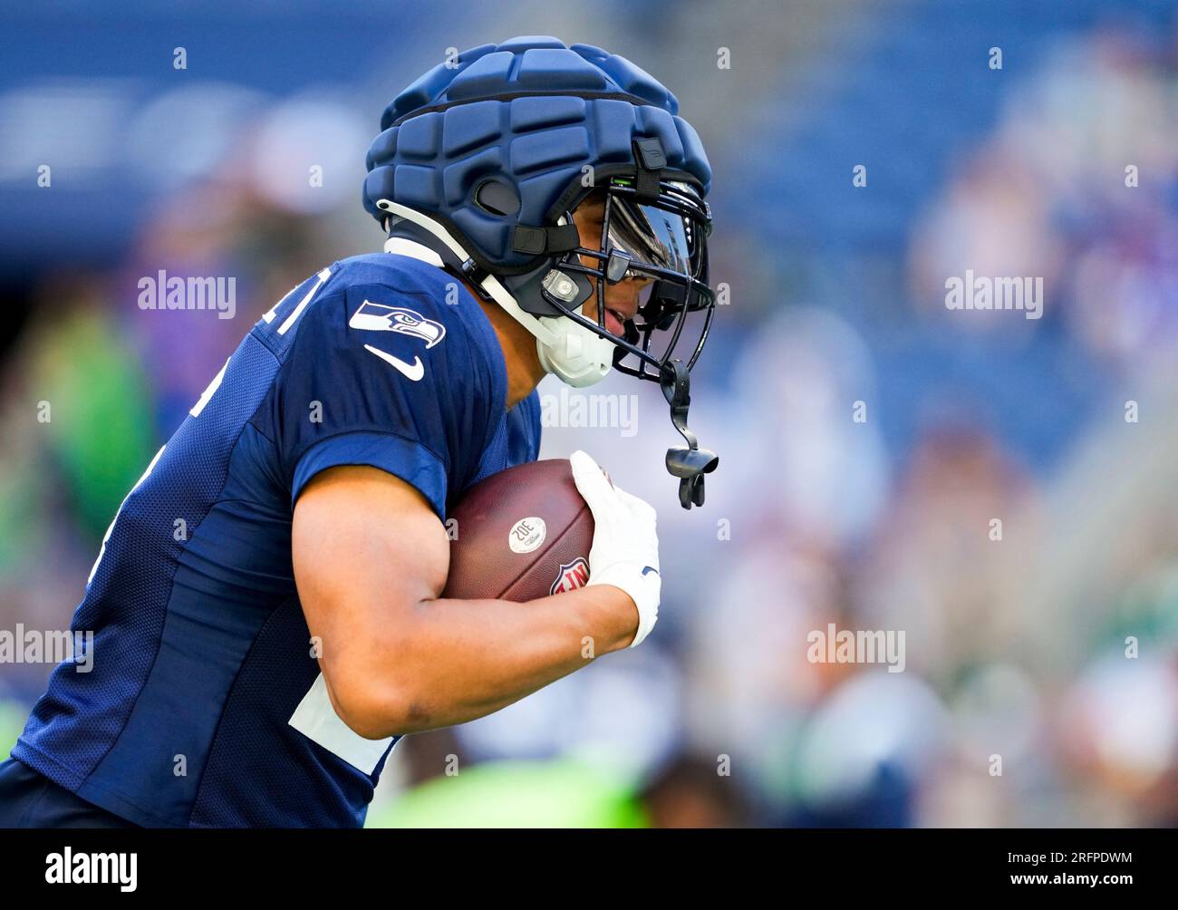 Seattle Seahawks running back Zach Charbonnet carries the ball before ...