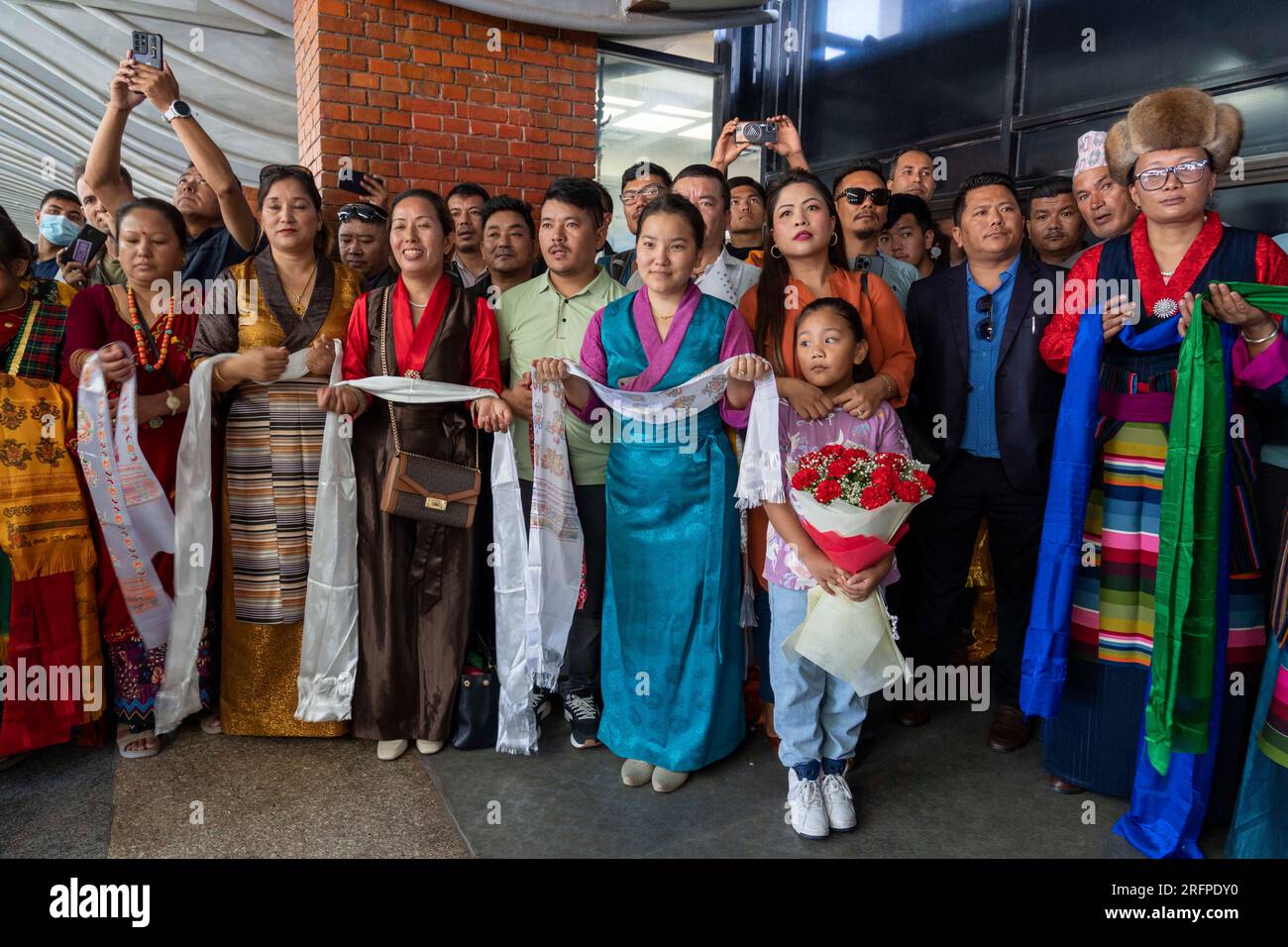 Family and friends wait to welcome Norwegian woman mountain climber ...