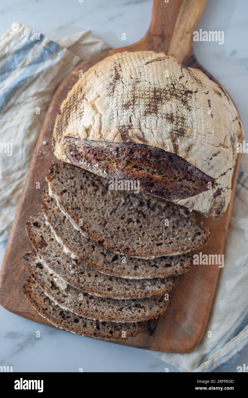 Home made whole grain bread on rustic wooden Stock Photo - Alamy