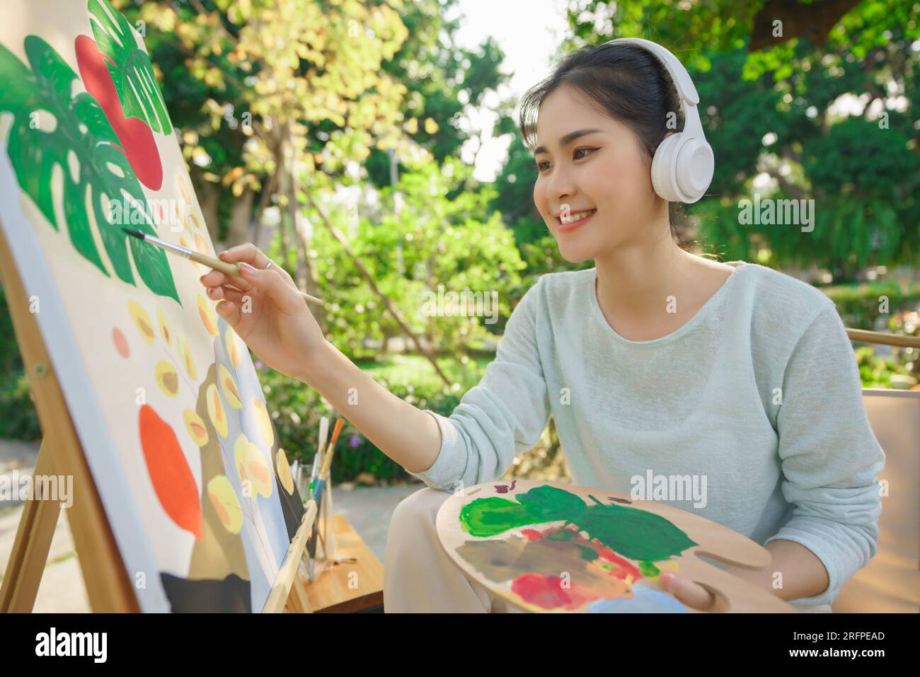 Artist concept, Female artist wear headphone to listening the music and ...