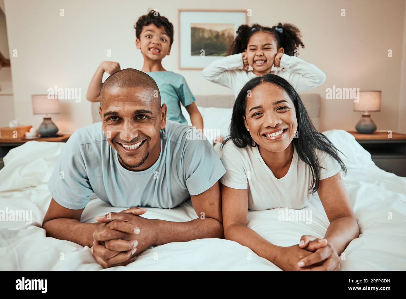 Happy family, portrait and bonding in bed, having fun and playing in ...