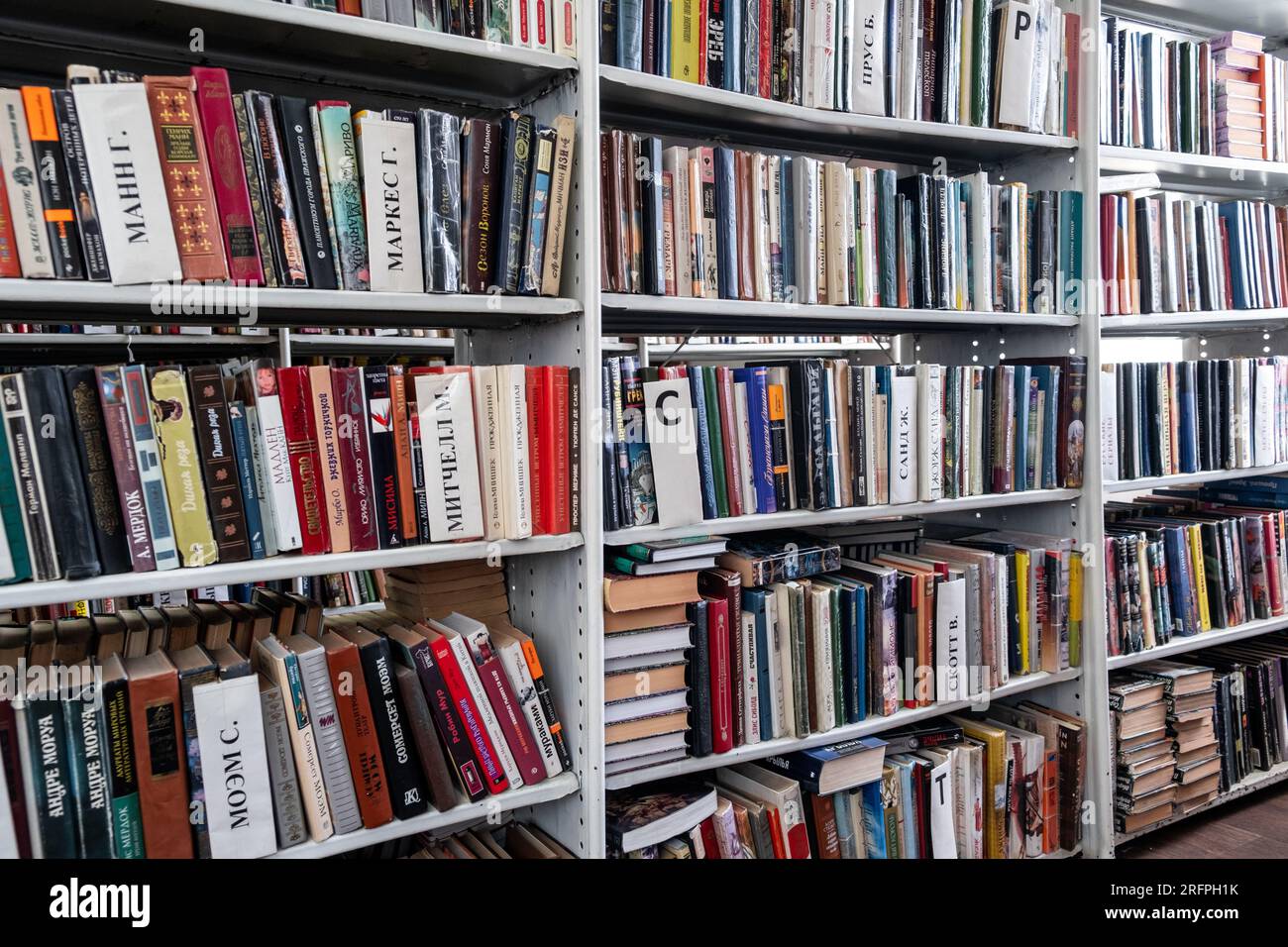 There are a lot of books on the shelves in the school library Stock ...